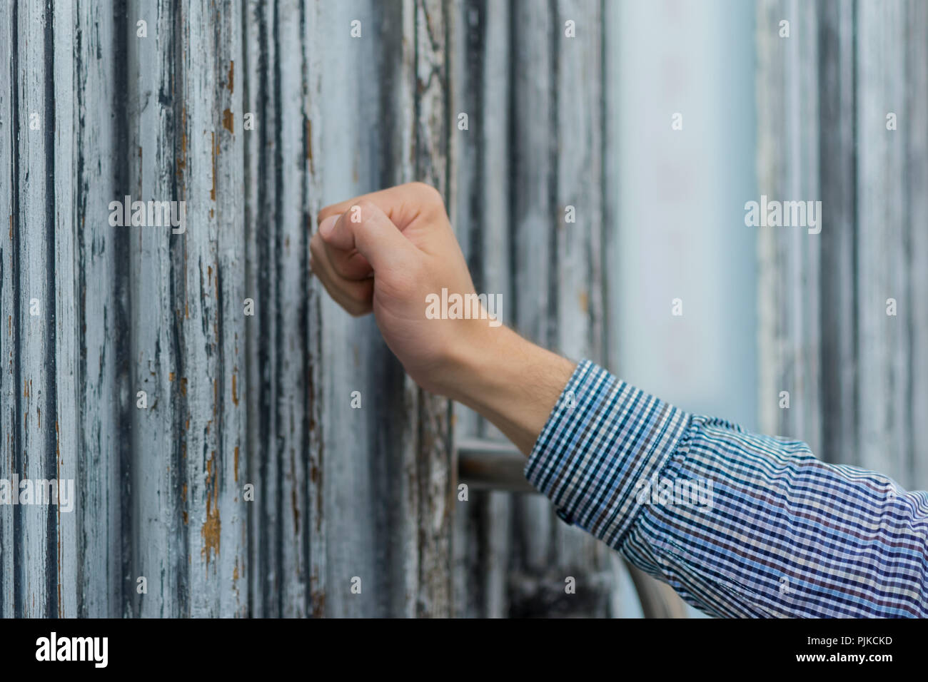 Door knock fist hi-res stock photography and images - Alamy