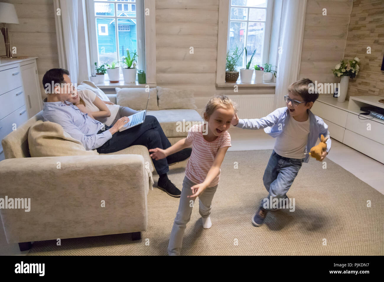Happy family spending time at home having fun together Stock Photo - Alamy