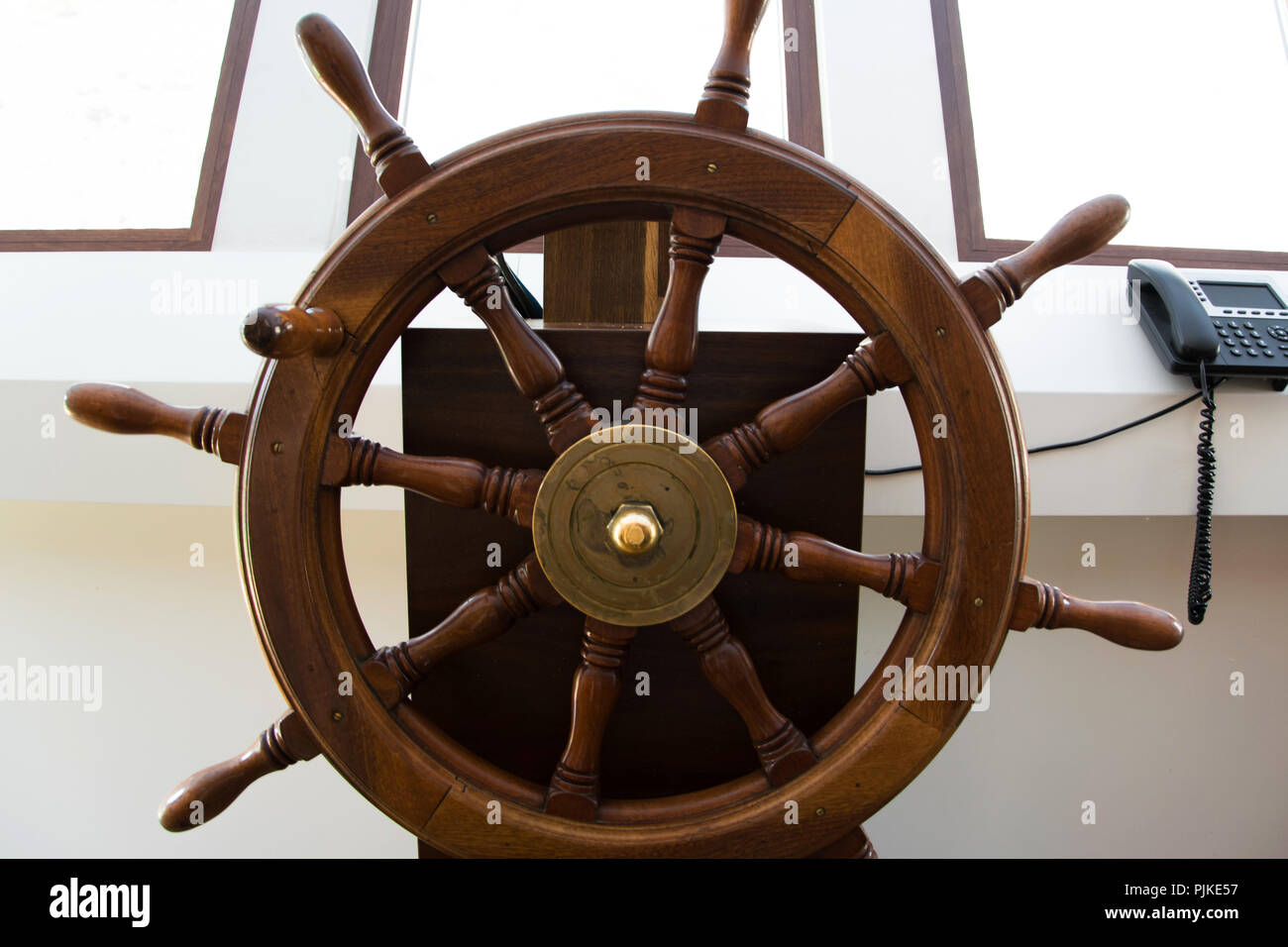 Front view of wooden rudder on a sailing ship inside the capitan's ...