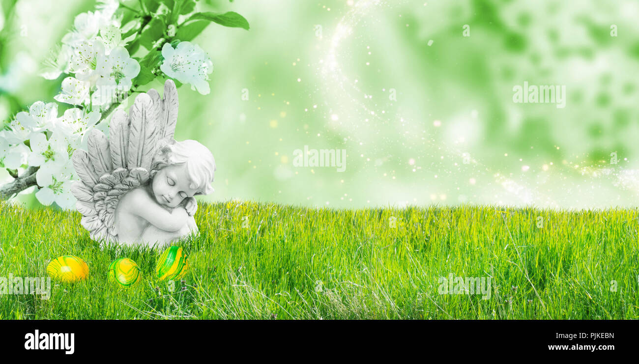 Angel on spring meadow with flowers and easter eggs Stock Photo - Alamy