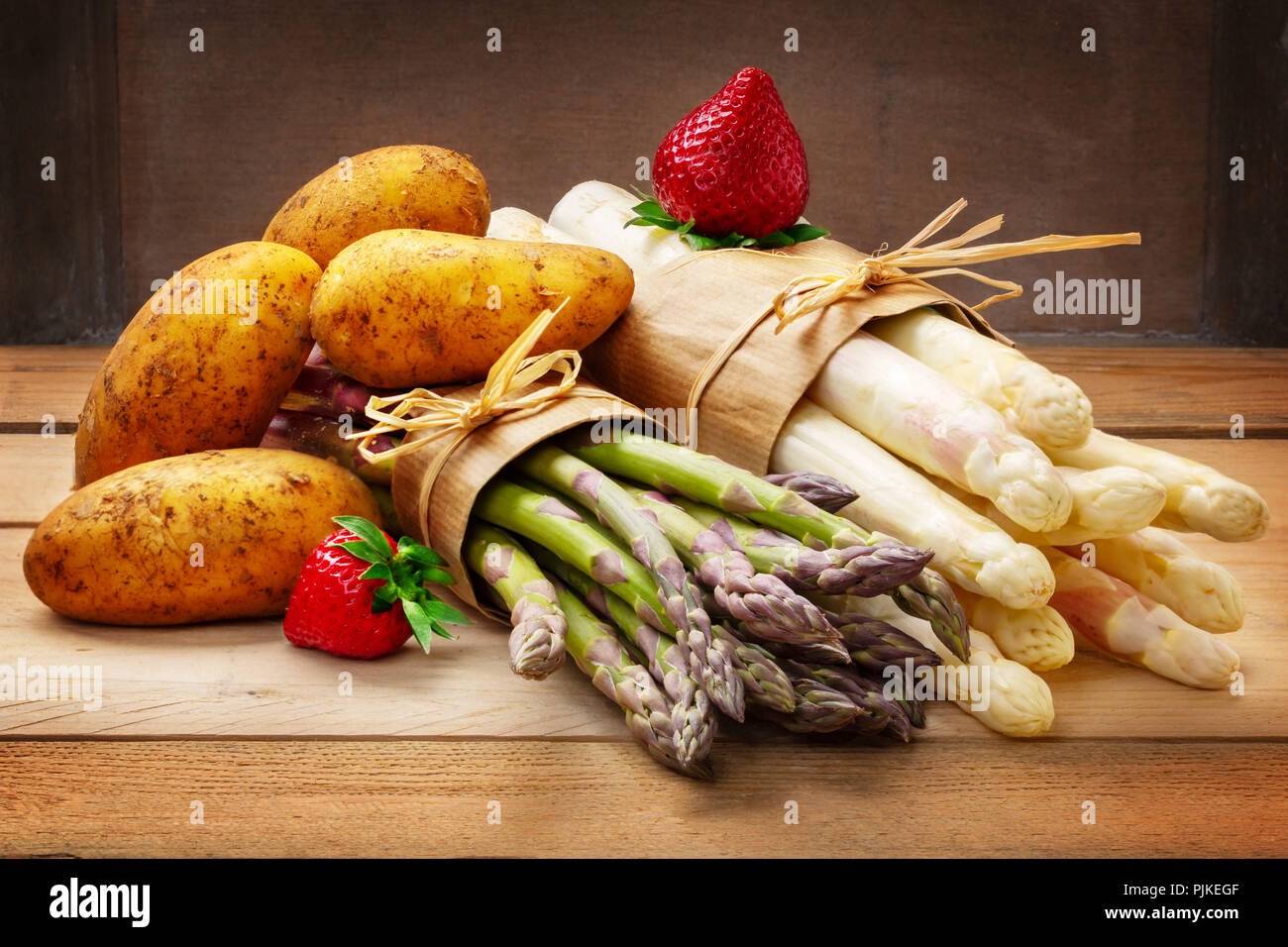 Strawberries and potatoes on wood hi-res stock photography and images ...