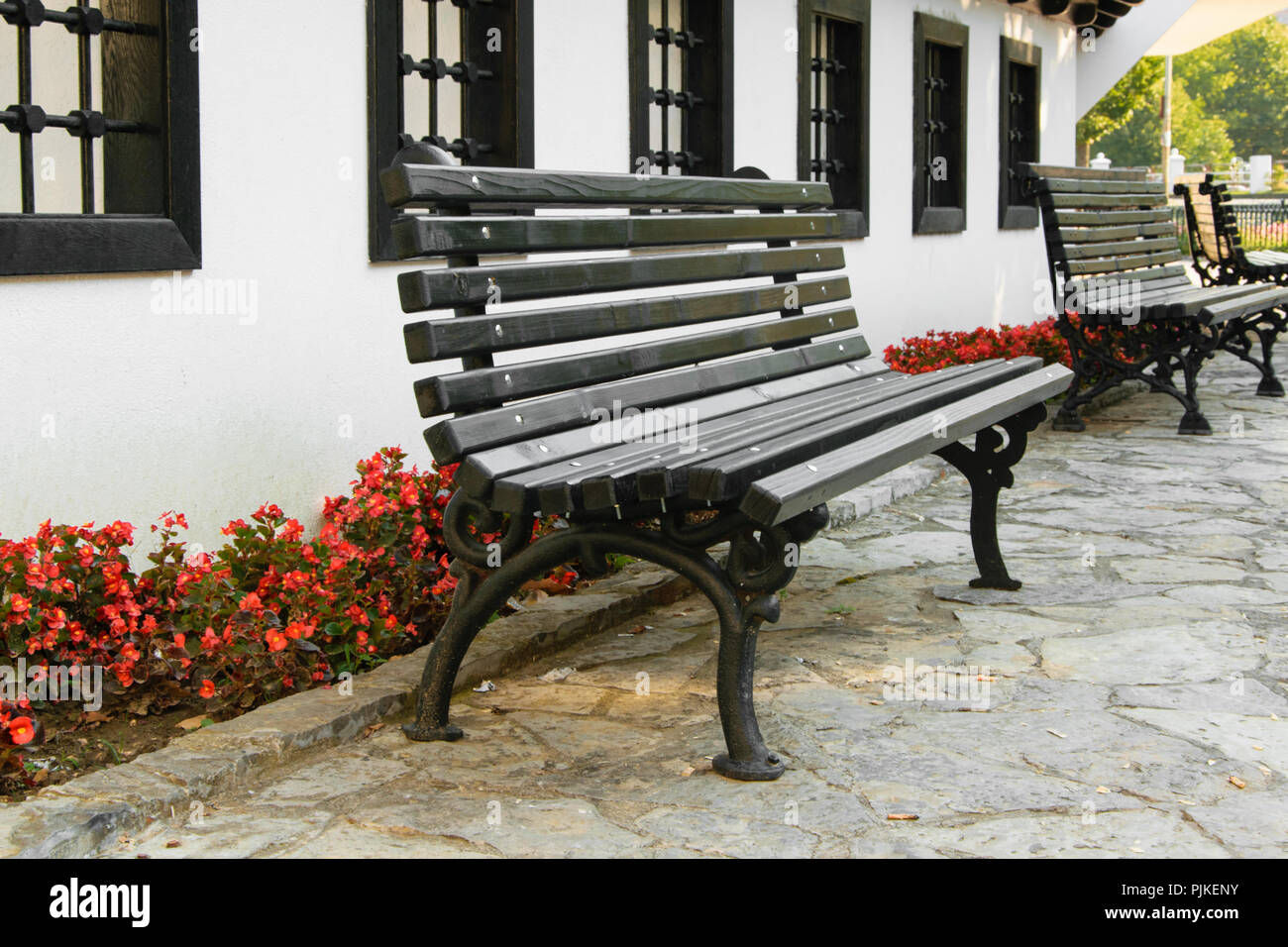 Benches in front of a traditional Balkan style house, architecture ...