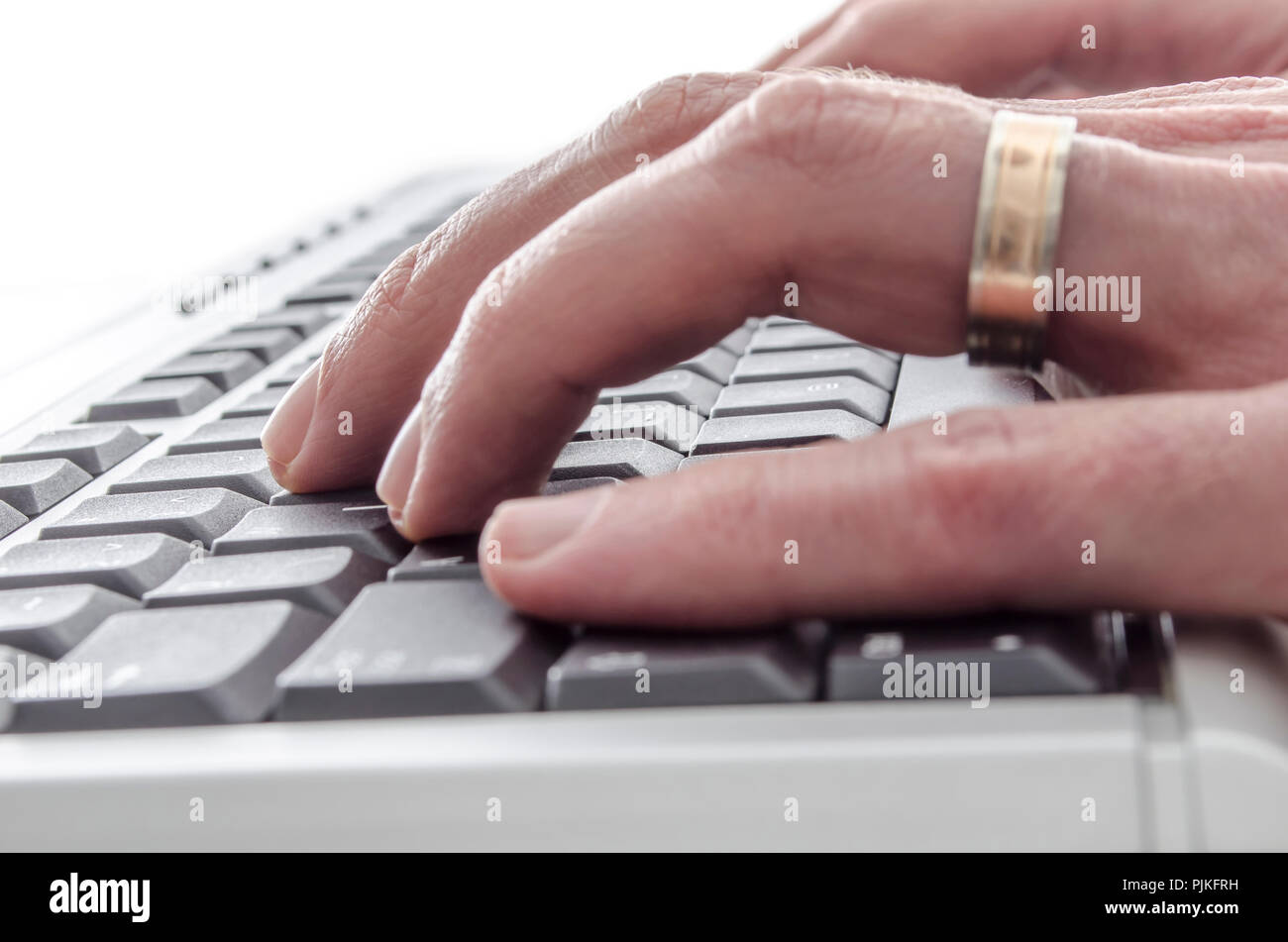 Detail of male fingers typing on keyboard Stock Photo - Alamy