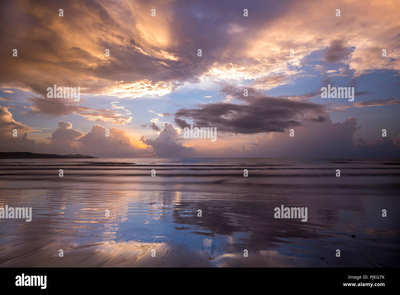 Sunrise on the beach at Magdalena Grand Beach Resort on Tobago Island ...