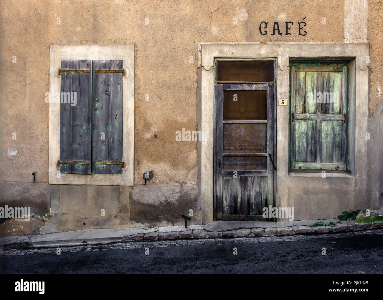 Old closed cafe in the center of Azillanet Stock Photo - Alamy