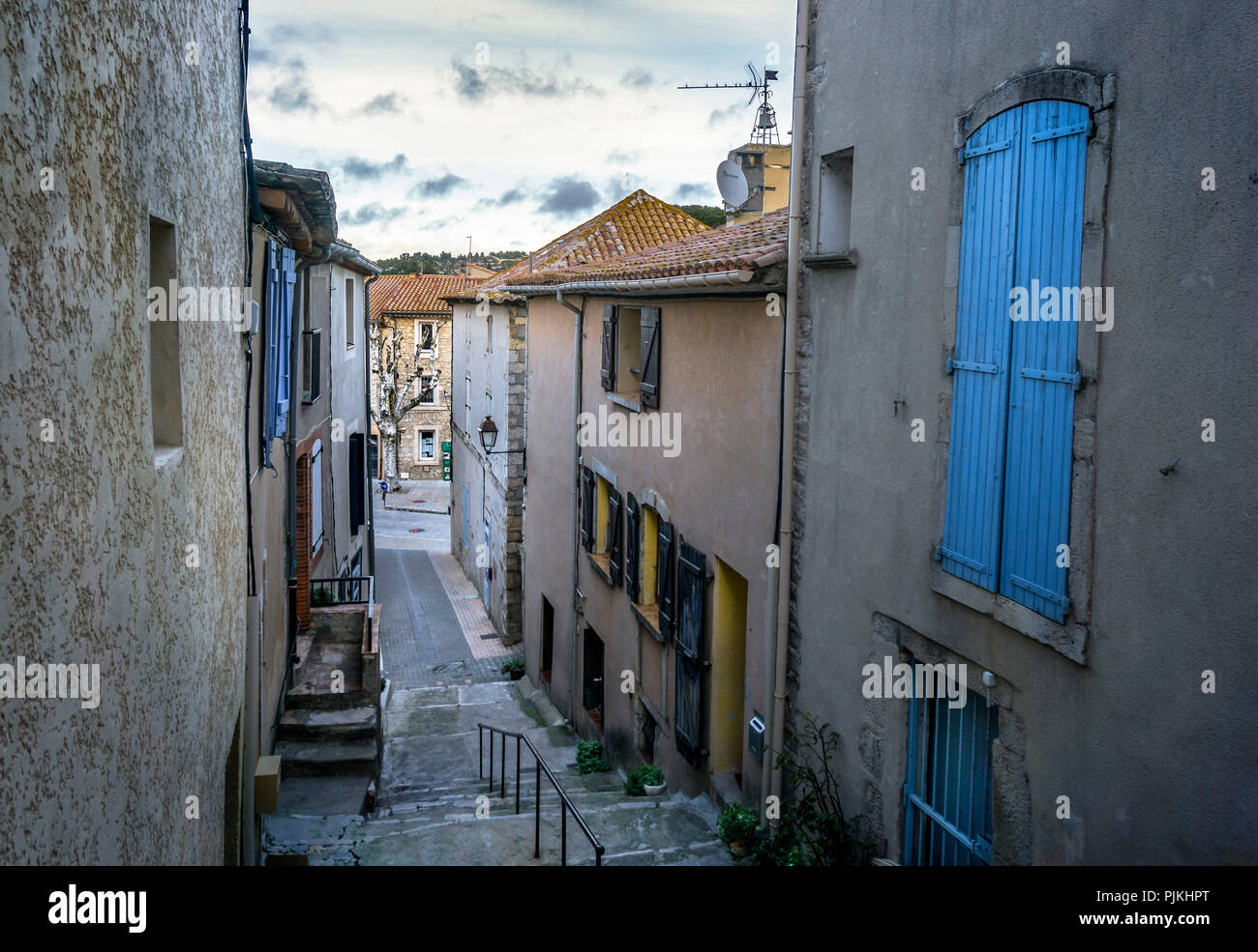 Alley and stairs of the old village center of Peyriac de Mer in winter ...
