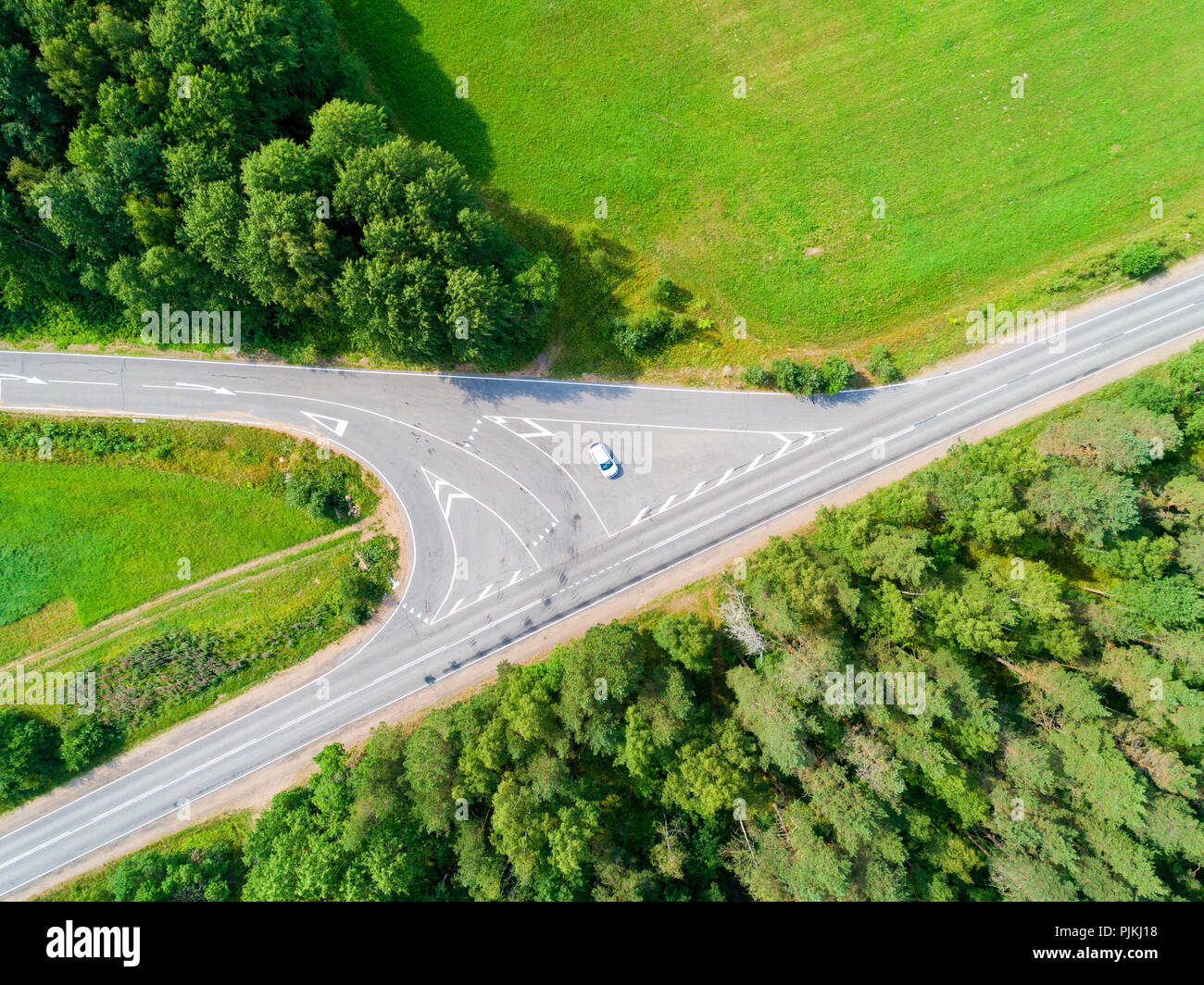Aerial view of highway. Aerial view of a country road with moving car ...