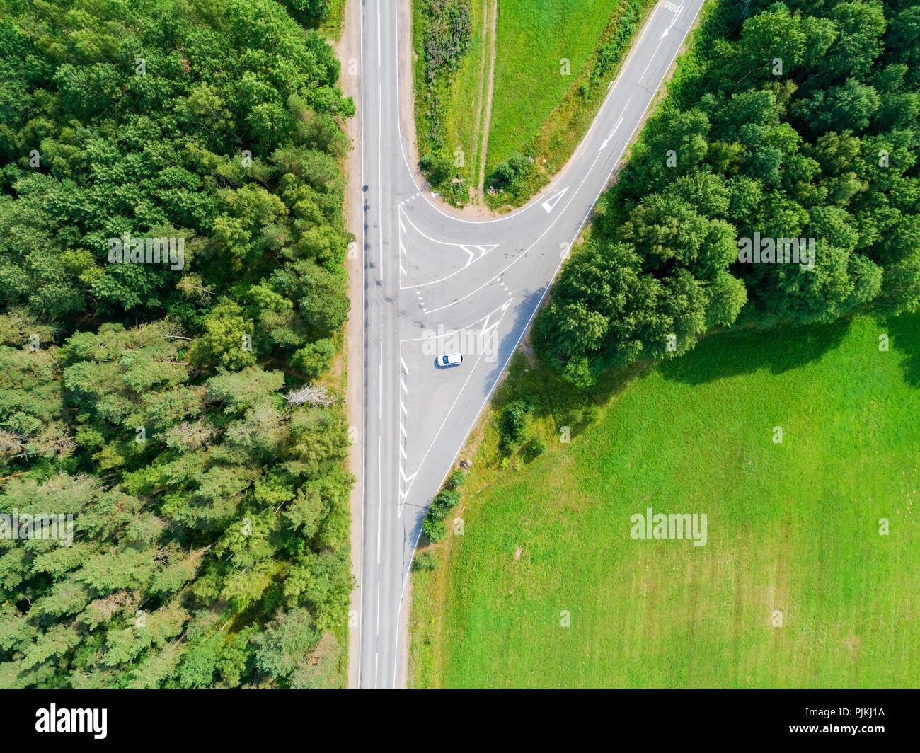 Aerial view of highway. Aerial view of a country road with moving car ...