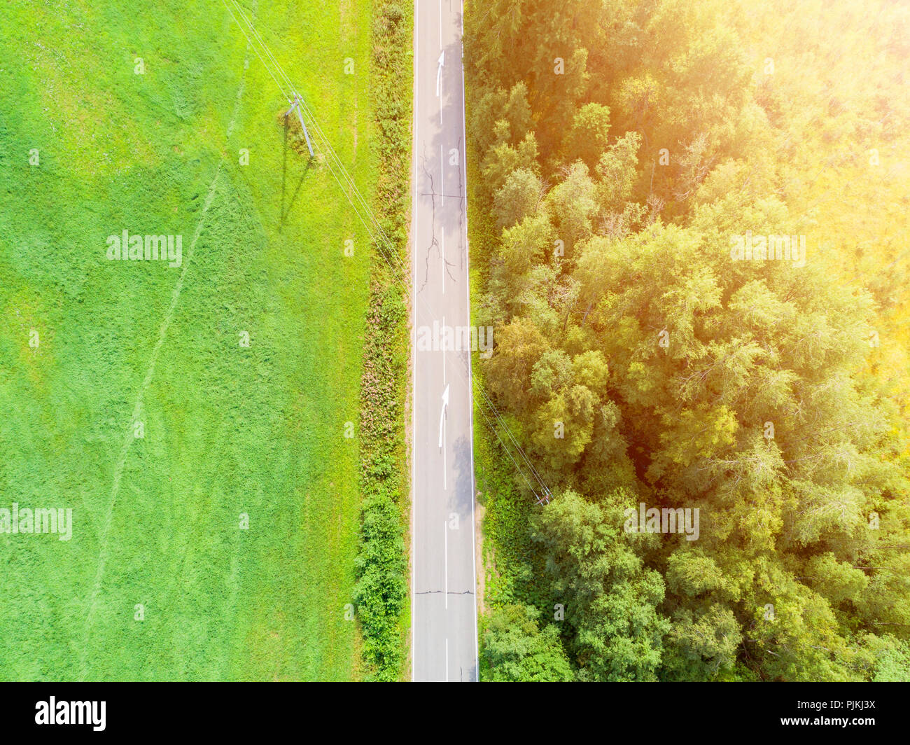 Aerial view of highway. Aerial view of a country road near the lake ...