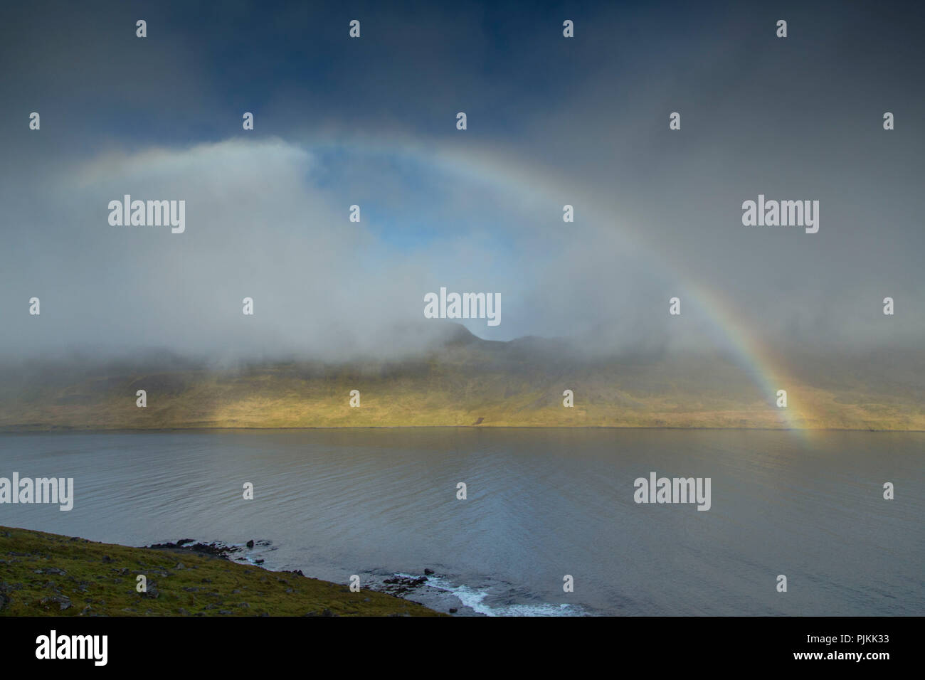 Iceland, Steingrimmfjord at Holmavik, rainbow, cloud mood Stock Photo ...