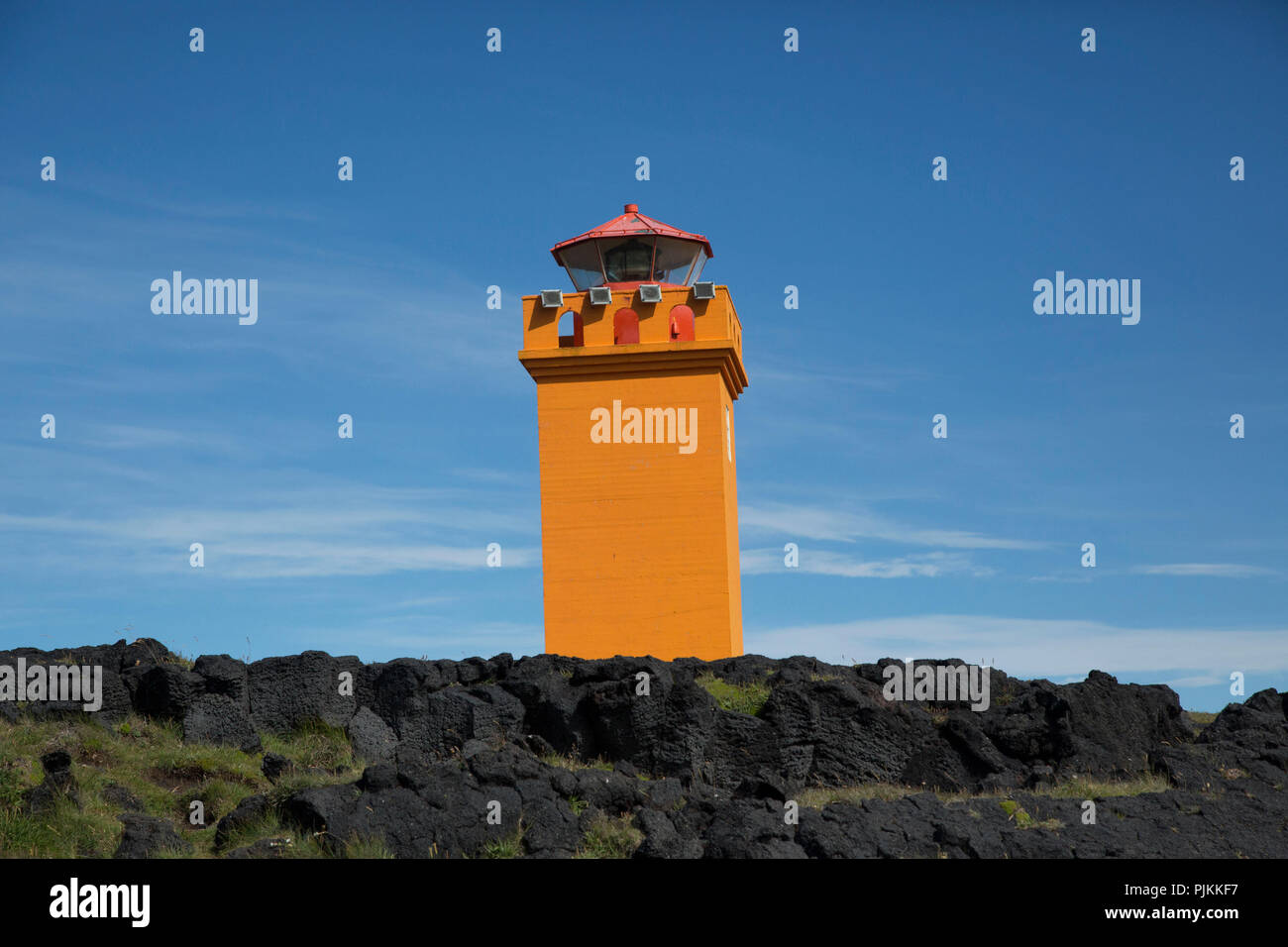 Iceland, Snaefellsness peninsula, yellow lighthouse at Hellissandur ...