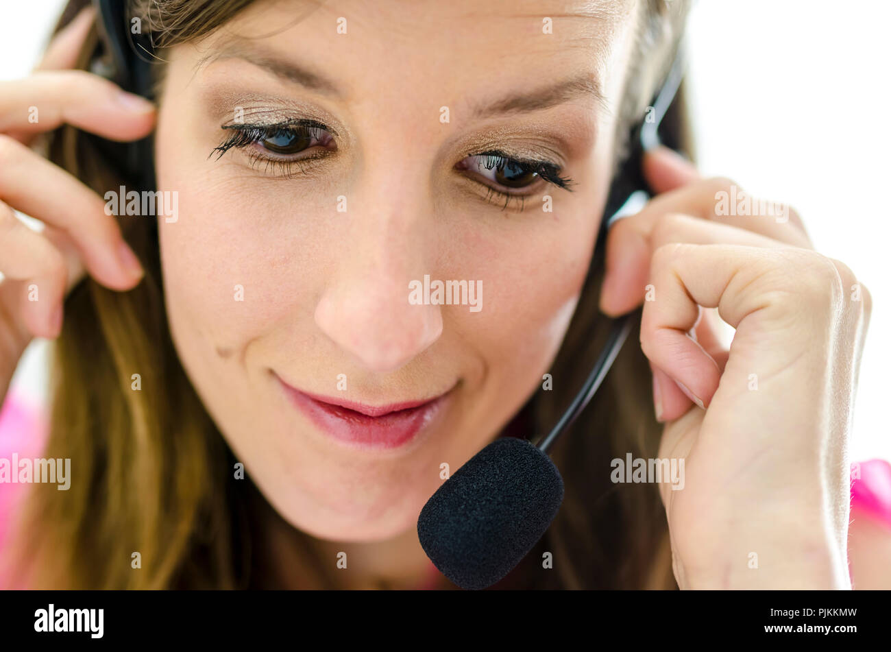 Portrait of slightly concerned female call center employee Stock Photo ...
