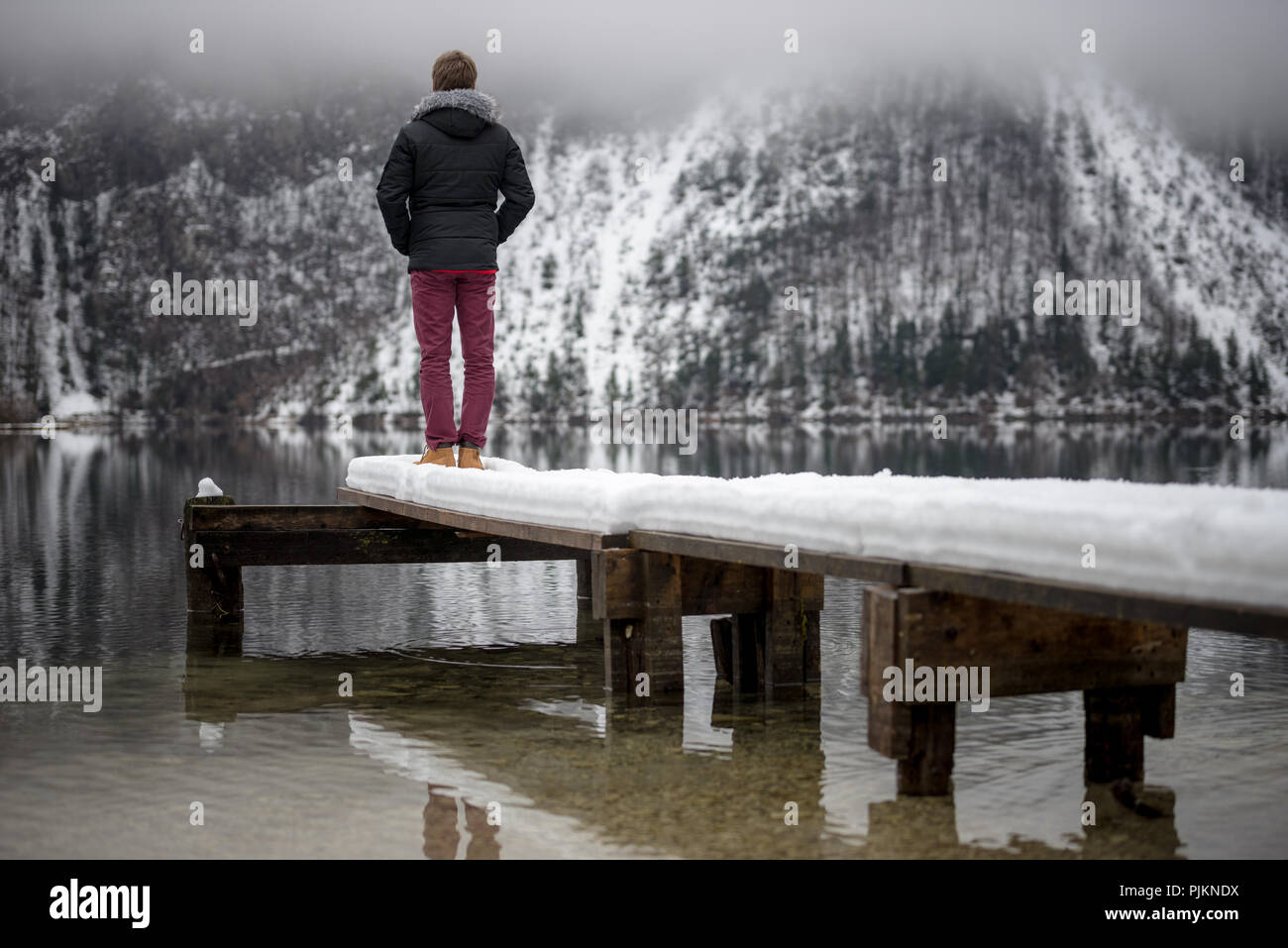 Man standing still from behind hi-res stock photography and images - Alamy