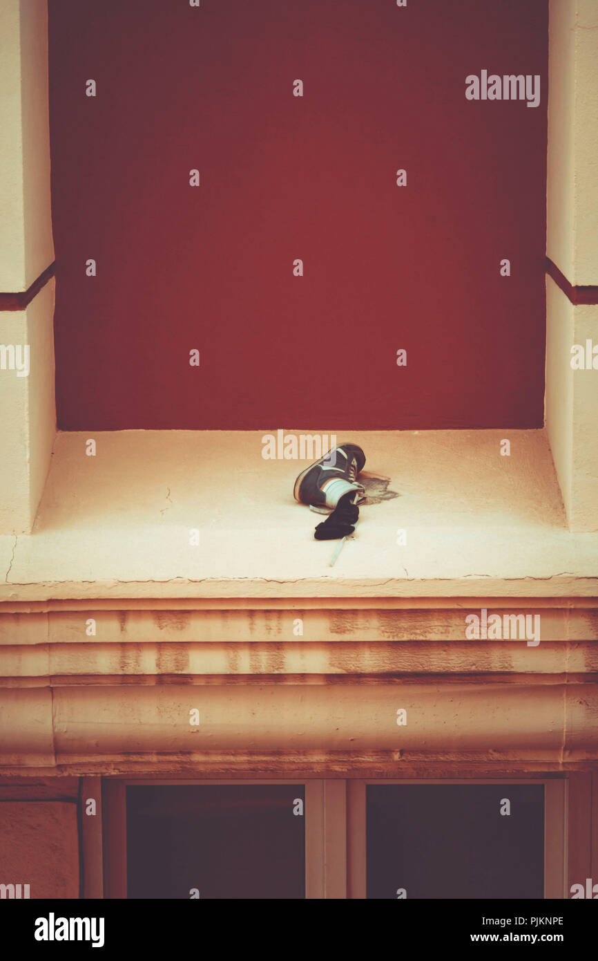 A single shoe alone and unreachable on a window sill Stock Photo - Alamy