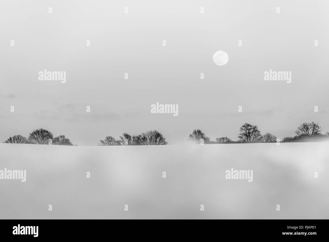 Full moon over snowy landscape hi-res stock photography and images - Alamy