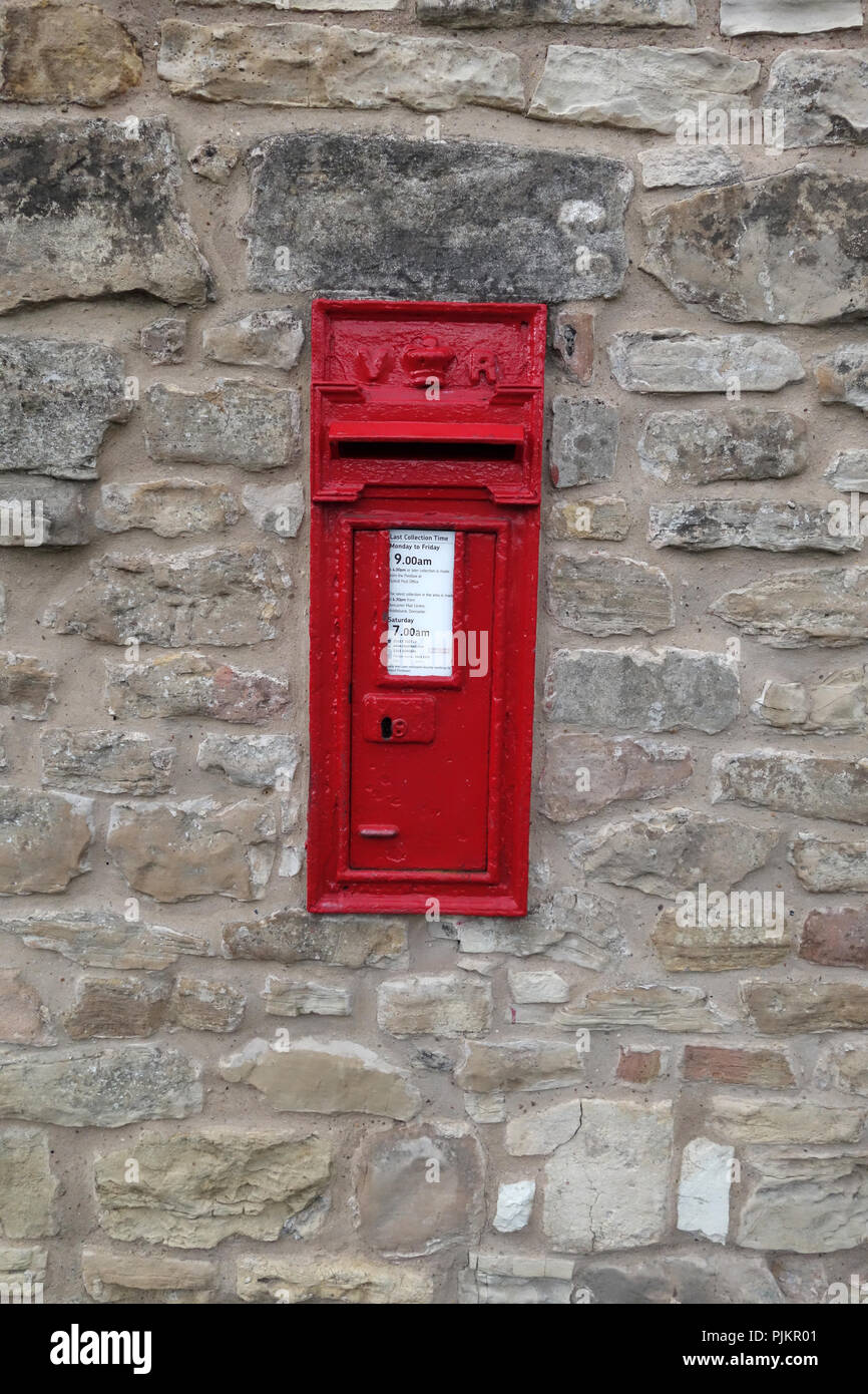 Letter box built into stone wall Stock Photo - Alamy
