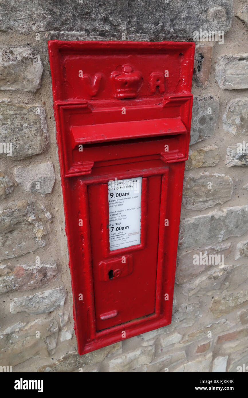 Letter box built into stone wall Stock Photo - Alamy