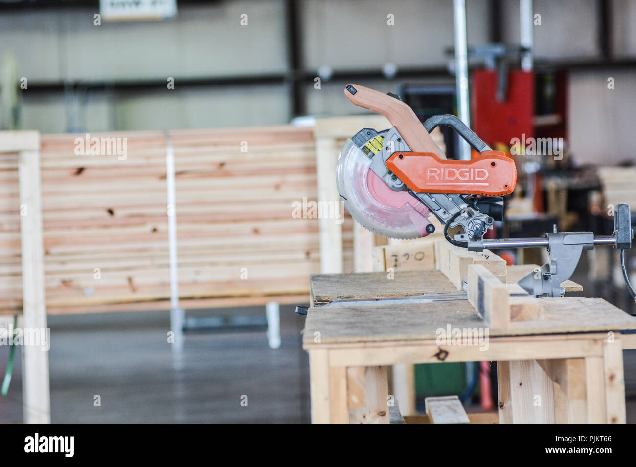 Construction equipment in warehouse use to build frames for new homes ...