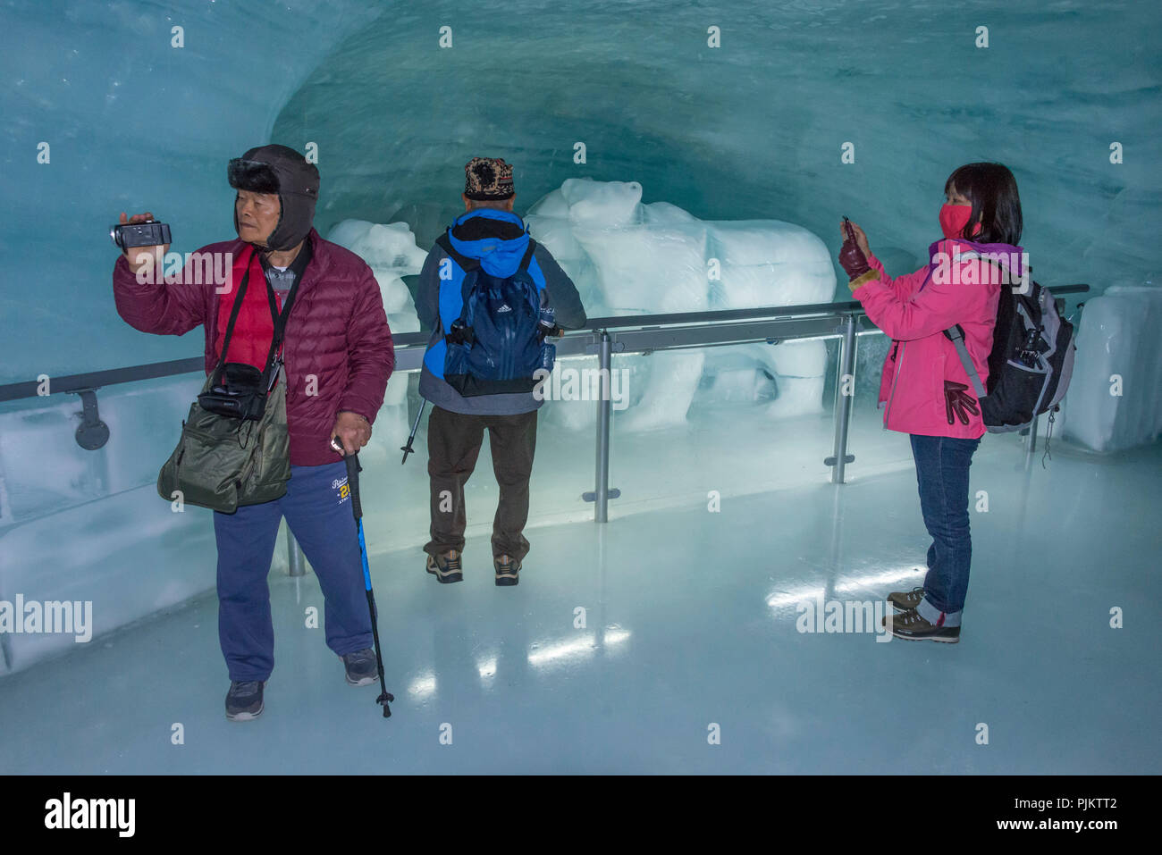 Woman visiting ice cave in hi-res stock photography and images - Alamy