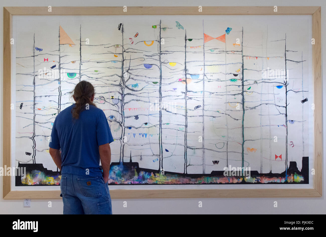 A patron at the Cahoon Museum of American Folk Art, touring the musem ...