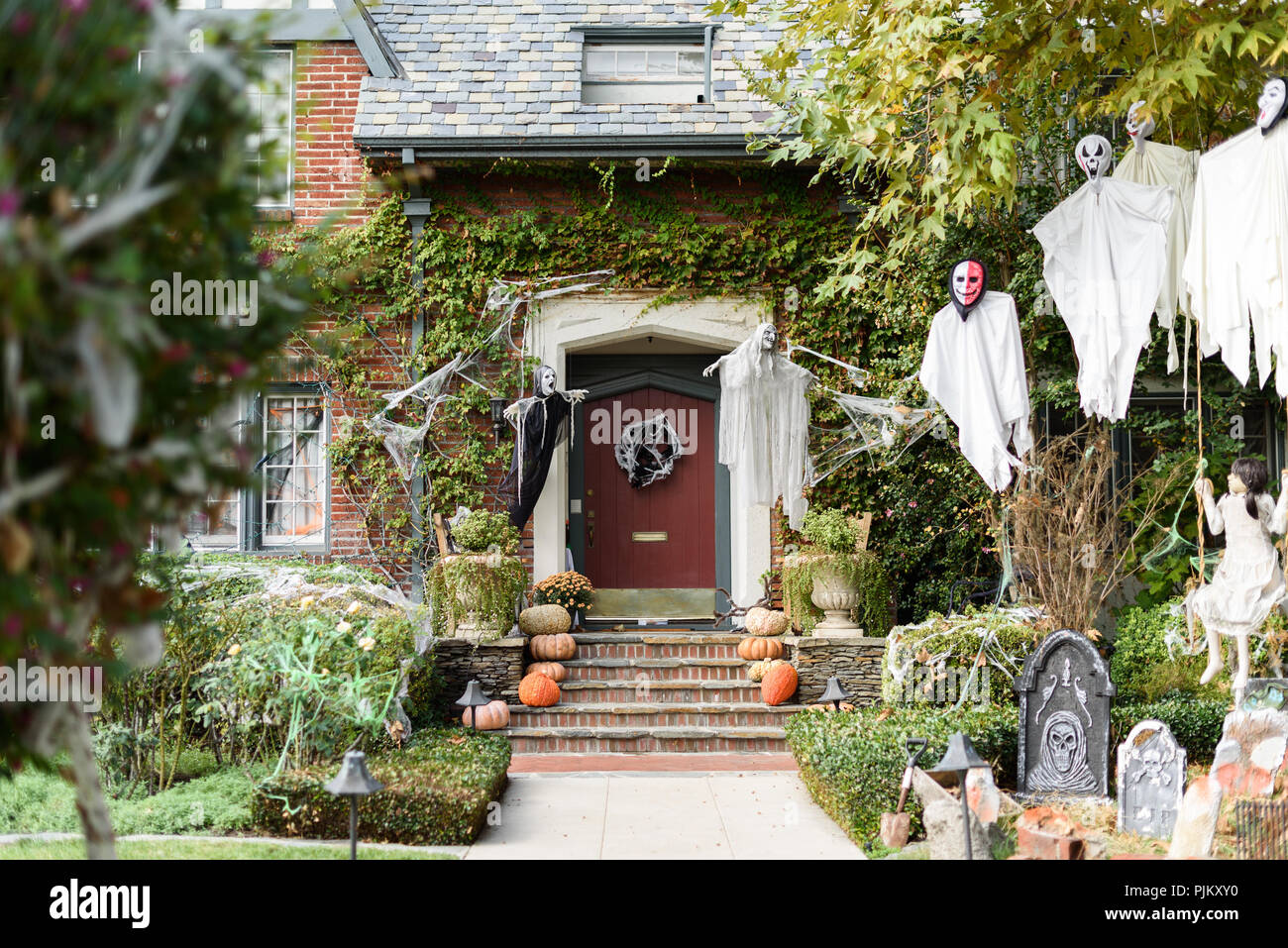 Halloween in front of house decorations Stock Photo - Alamy