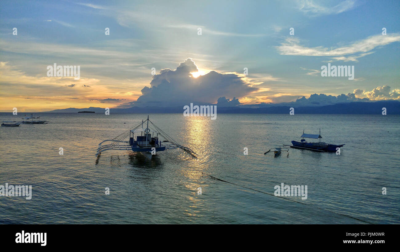 Sunset over the sea on Cebu, Philippines Stock Photo - Alamy