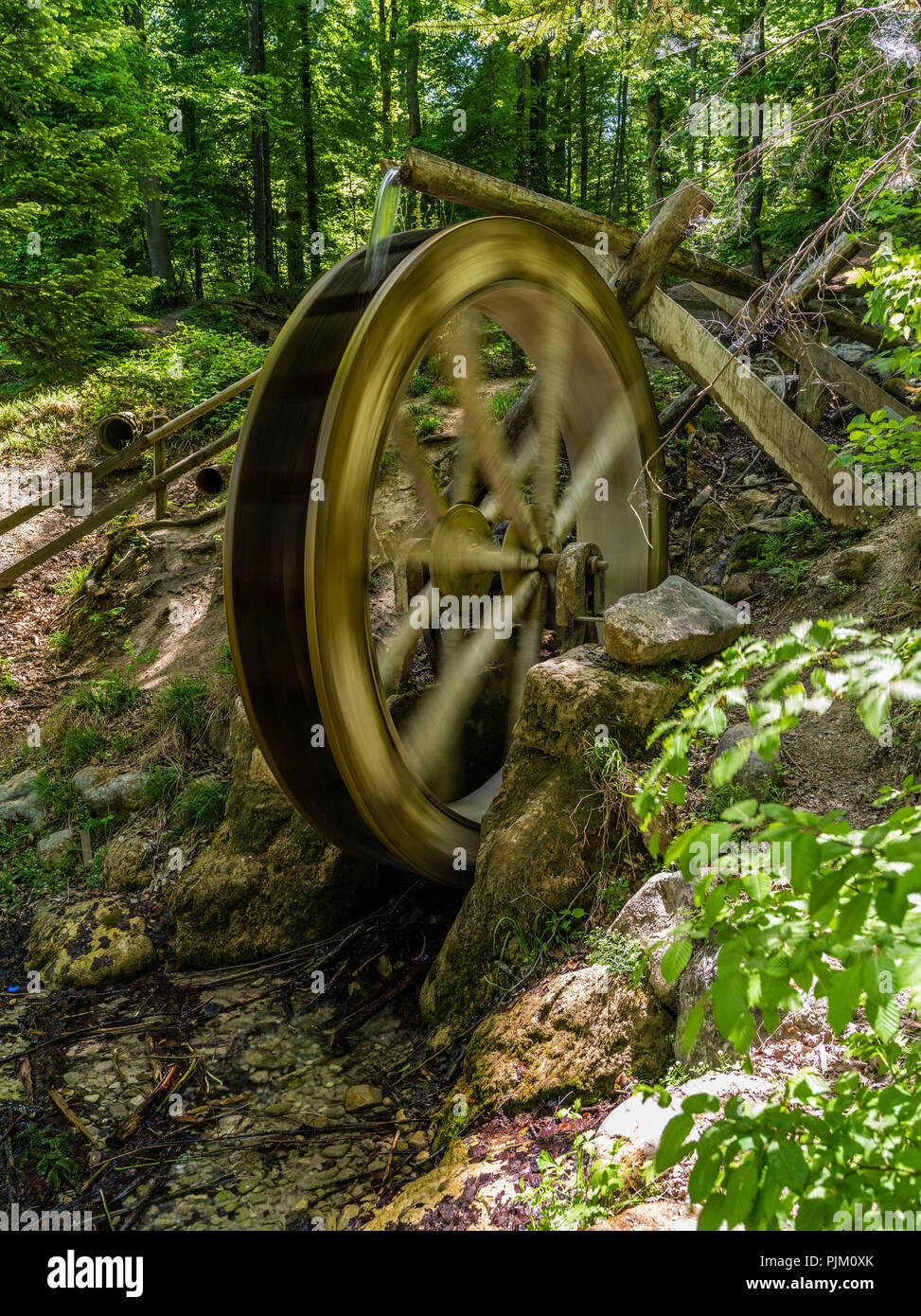 Old hydro powered mill wheel in the forest Stock Photo - Alamy
