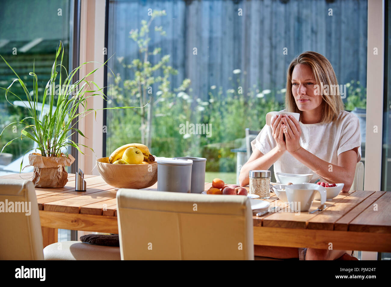 Woman breakfast table hi-res stock photography and images - Alamy