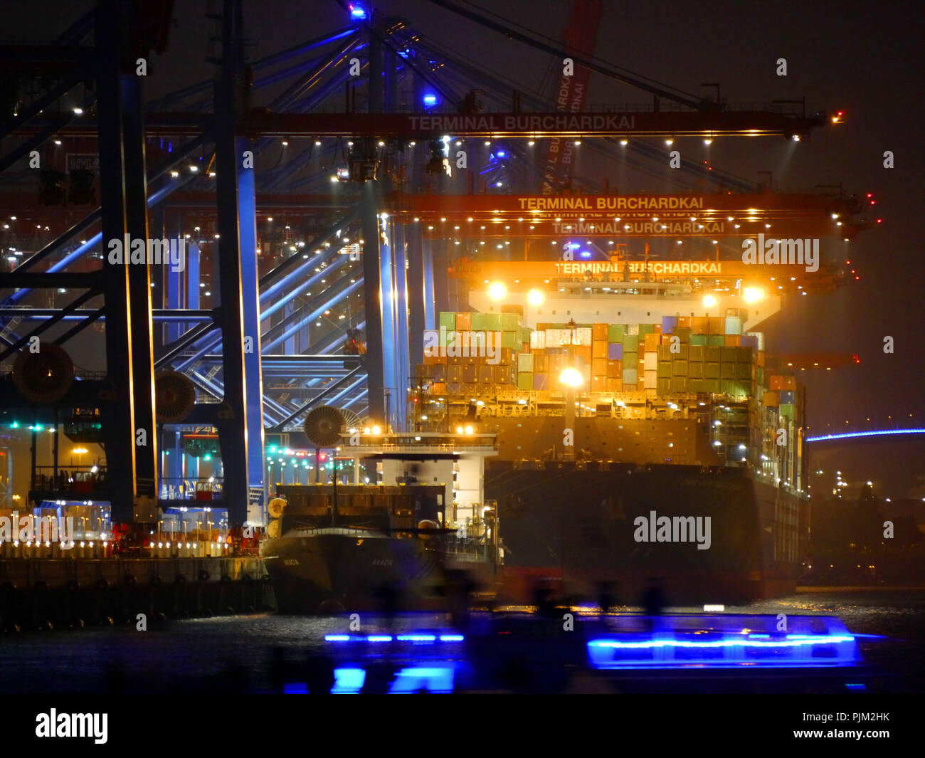 Container terminal by night Stock Photo - Alamy