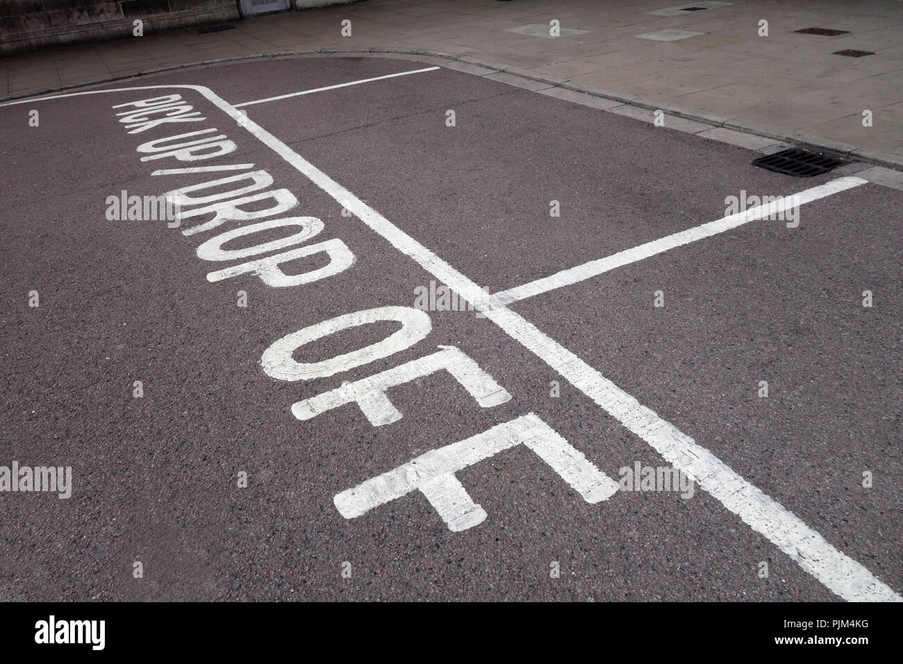 The words 'Drop off' written on road surface in a car park Stock Photo ...