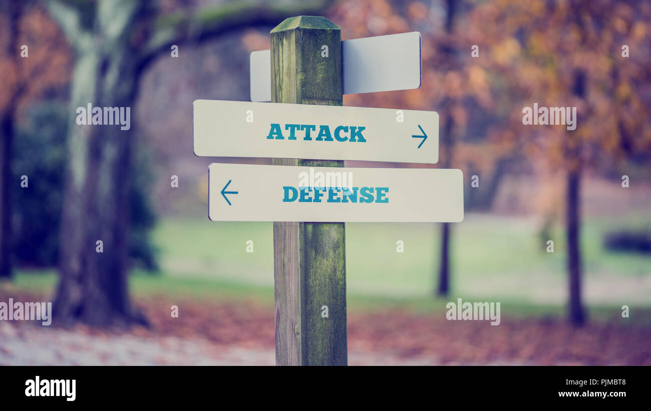 Rustic wooden sign in an autumn park with the words Attack - Defense ...