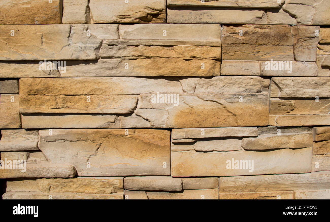 Brick wall texture. Close up of rough slate stone exterior brick ...