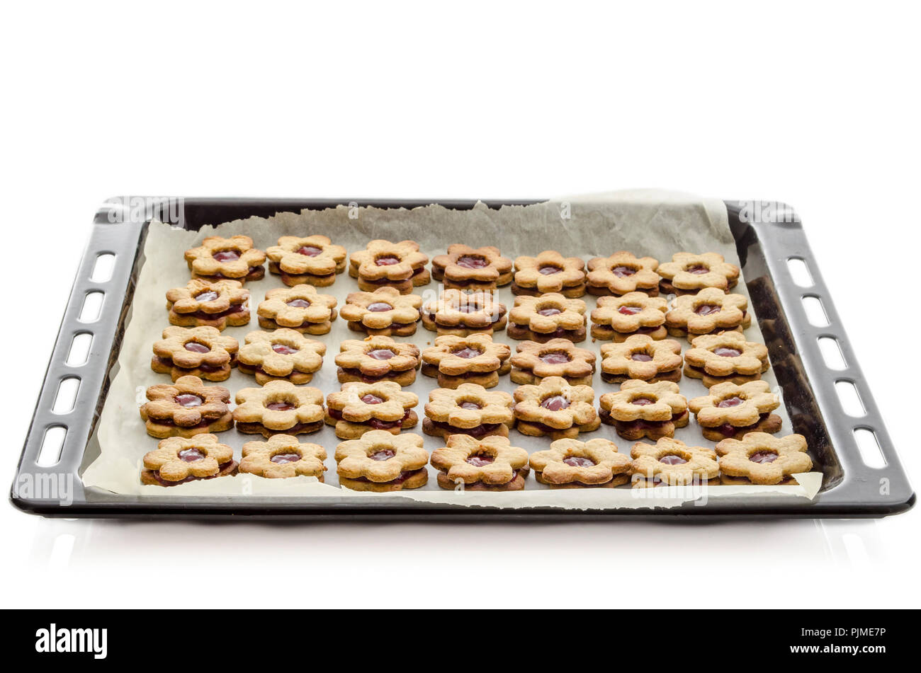 Baking tray with jam cookies isolated over white background Stock Photo ...