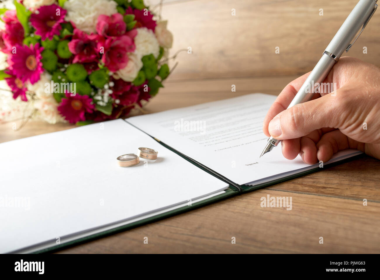 Signing marriage certificate hi-res stock photography and images - Alamy