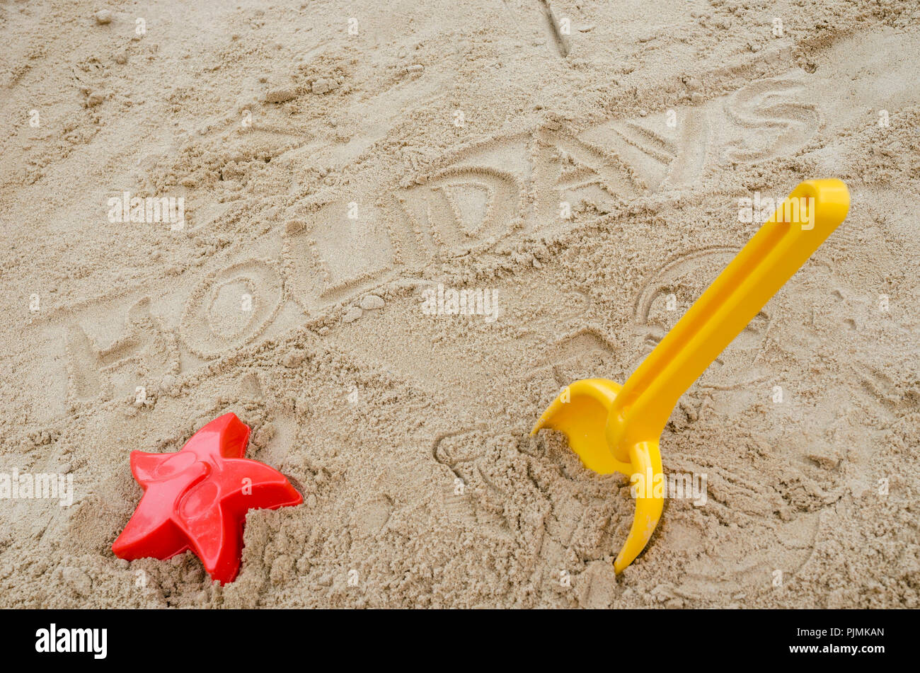 Word holidays written in sand. Concept of happy summer holiday Stock ...