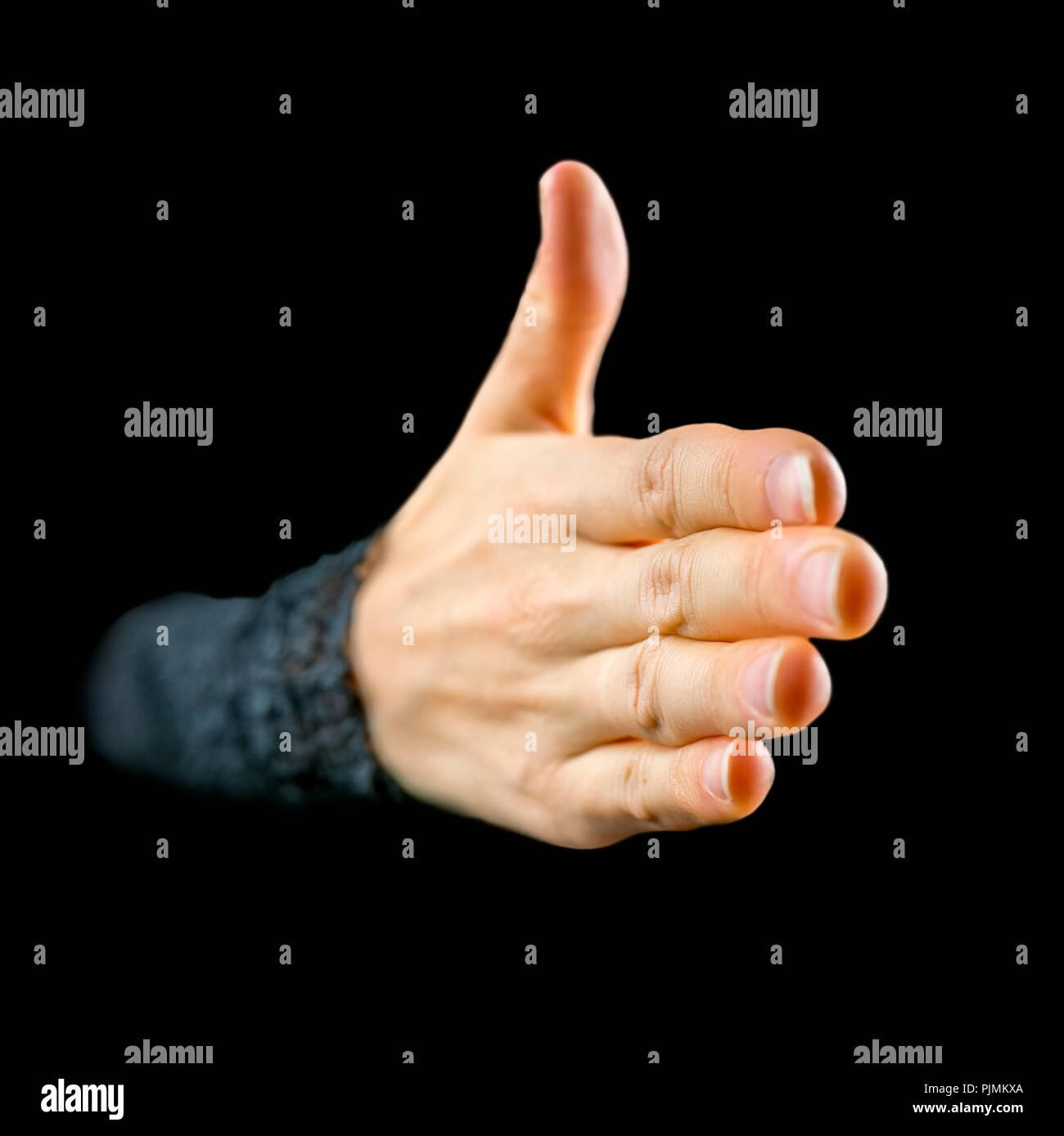 Female hand reaching for a handshake out of a black background Stock ...