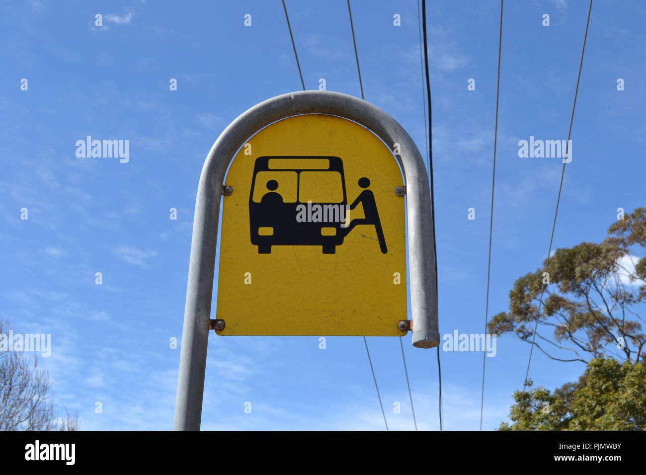 Waiting for the bus. Bus Stop Sign Stock Photo - Alamy