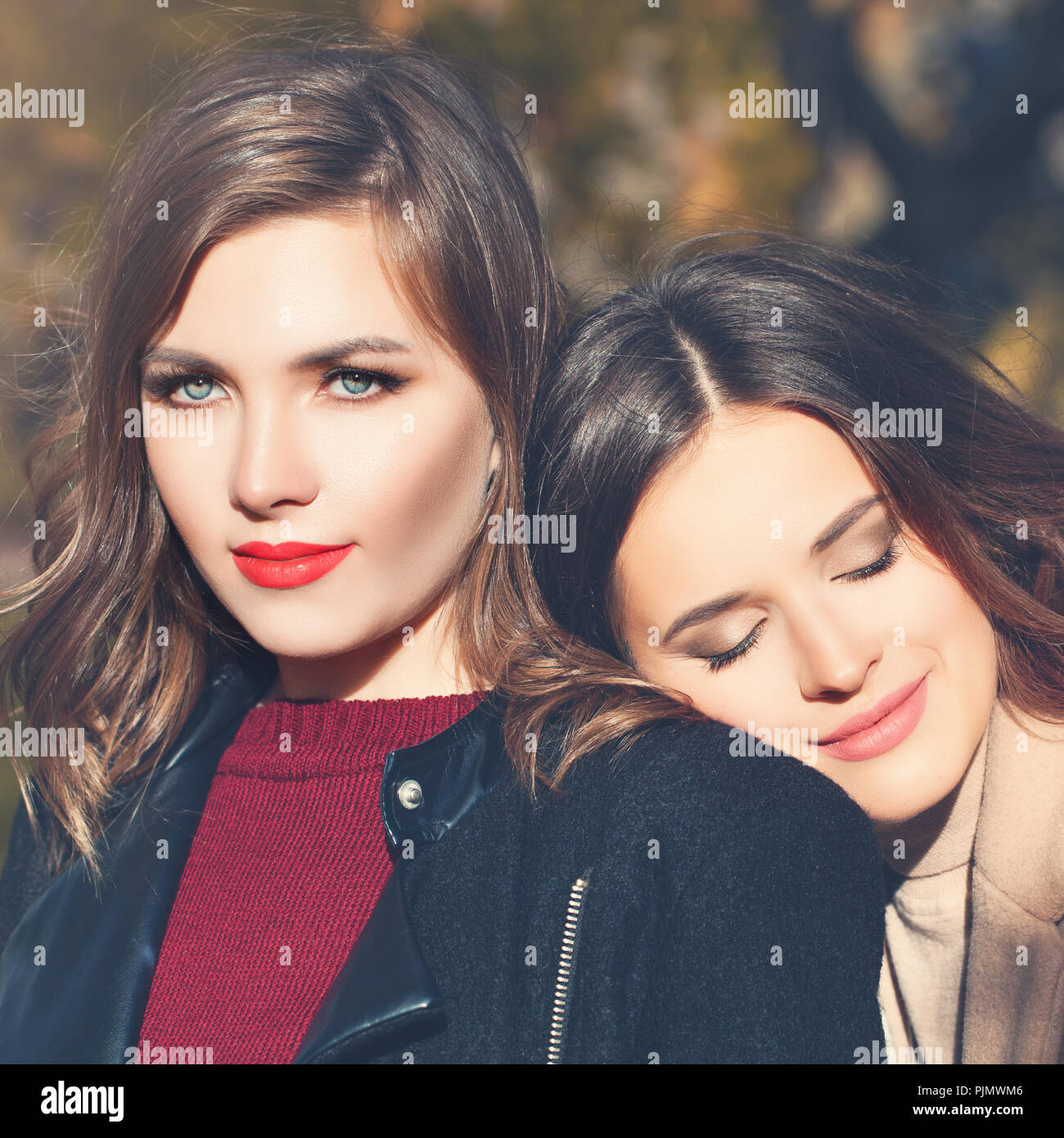 Beautiful women faces closeup portrait, girls outdoor in autumn park ...