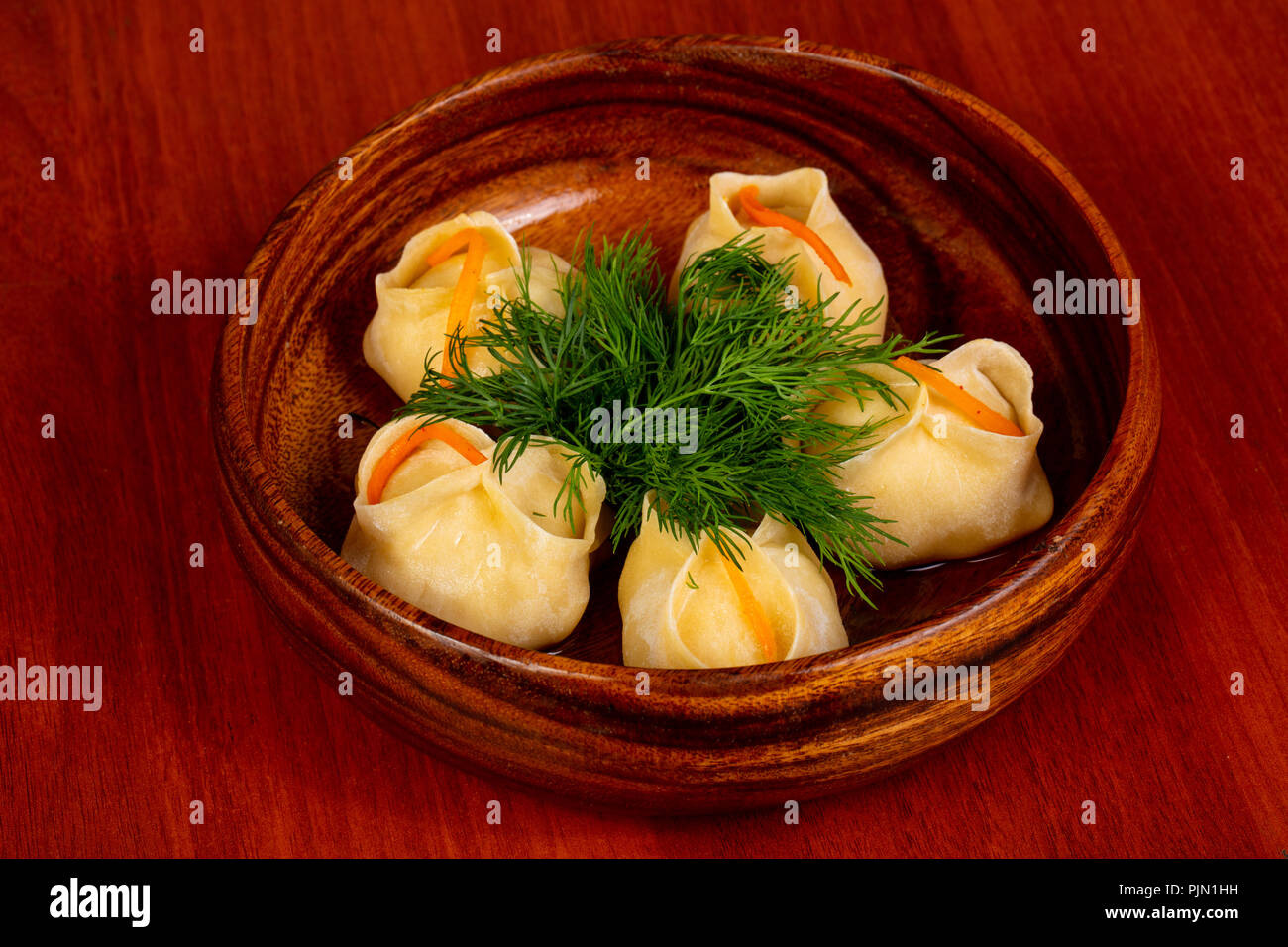 Uzbek traditional dumplings - Manti with meat Stock Photo - Alamy