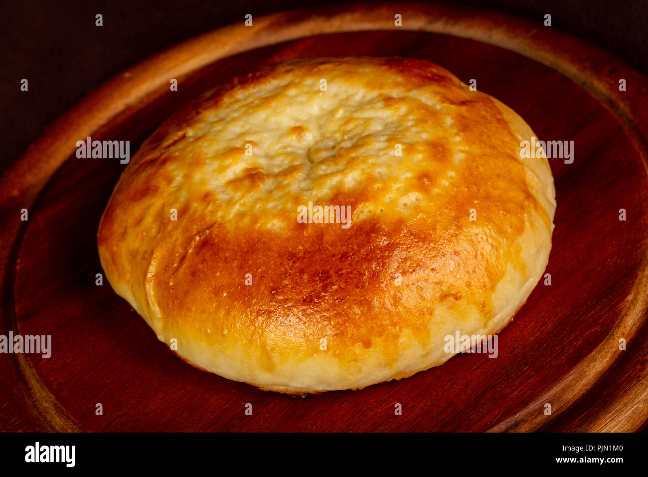 Lepeshka with cheese over wooden Stock Photo - Alamy