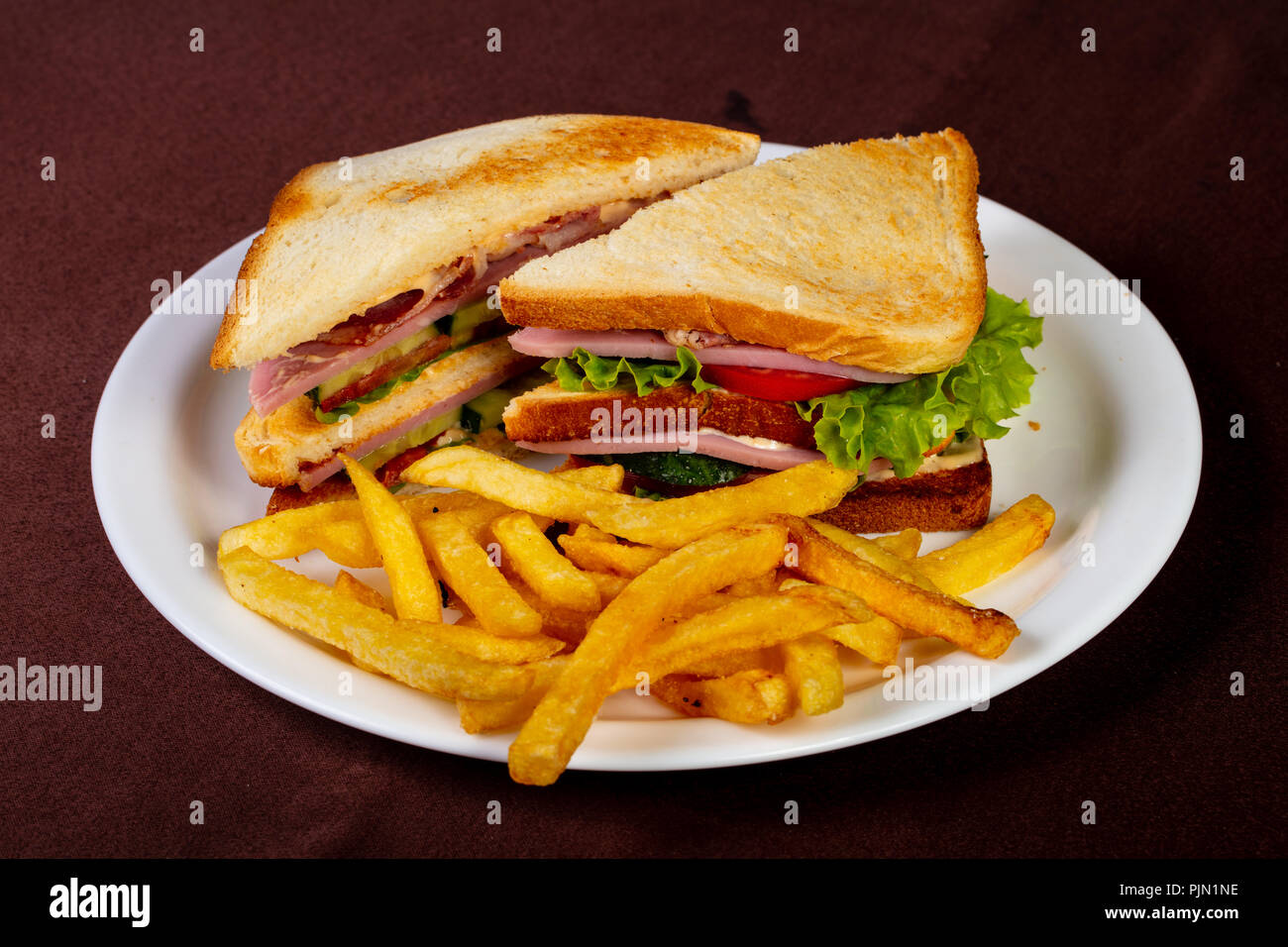 Club sandwich with ham and cheese Stock Photo - Alamy