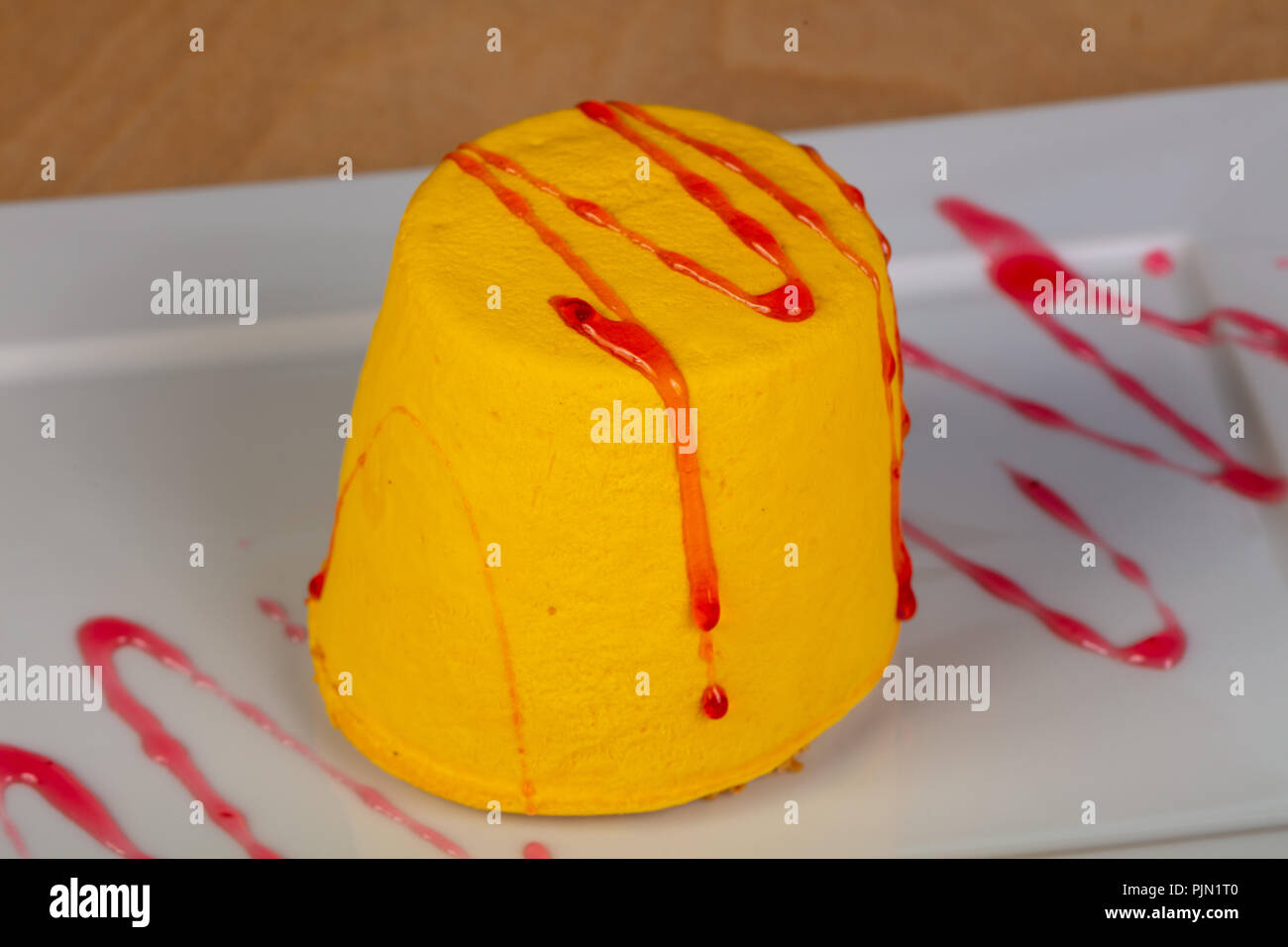 Mousse with mango in the plate Stock Photo - Alamy