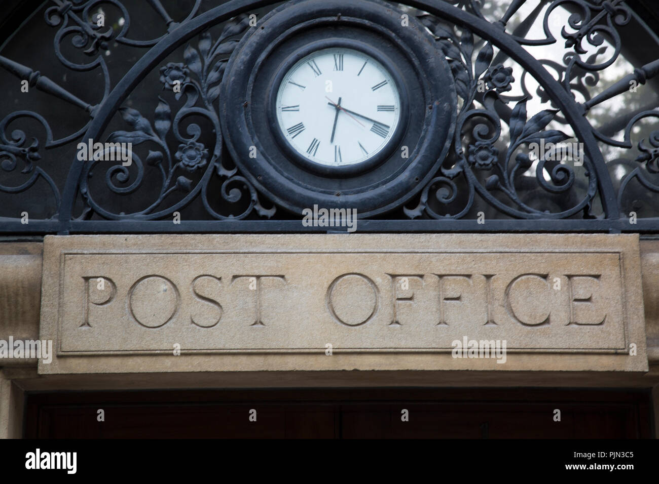 Post Office Sign with Clock, England Stock Photo - Alamy