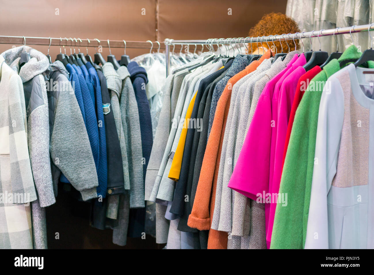 Fashionable clothes in a boutique store. Women clothing store Stock ...