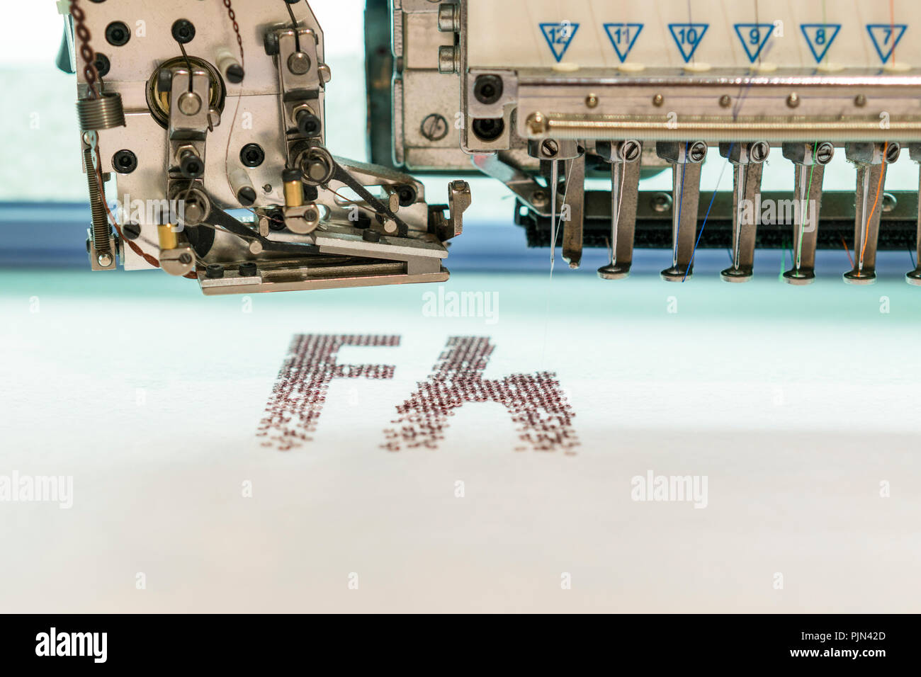 Computerized embroidery machines. sewing machine on blurred background ...