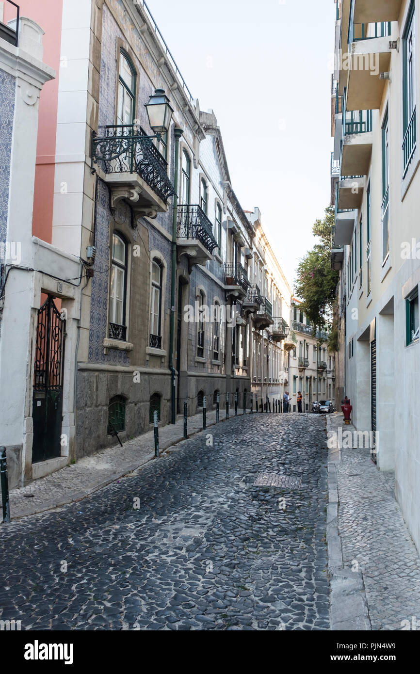 Narrow street in Alfama, Lisbon, Portugal. Alfama is the oldest ...