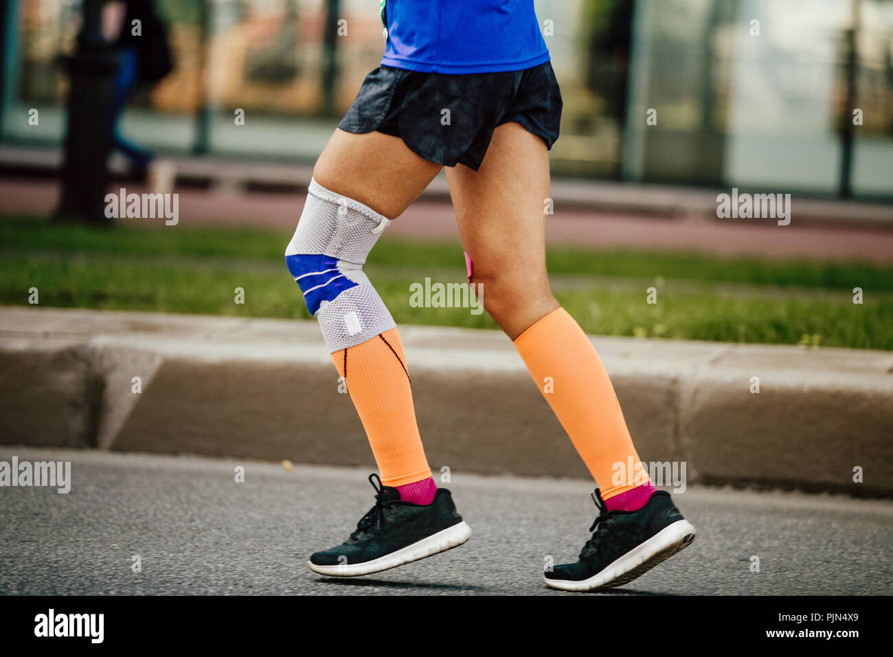 Runner legs in compression hi-res stock photography and images - Alamy