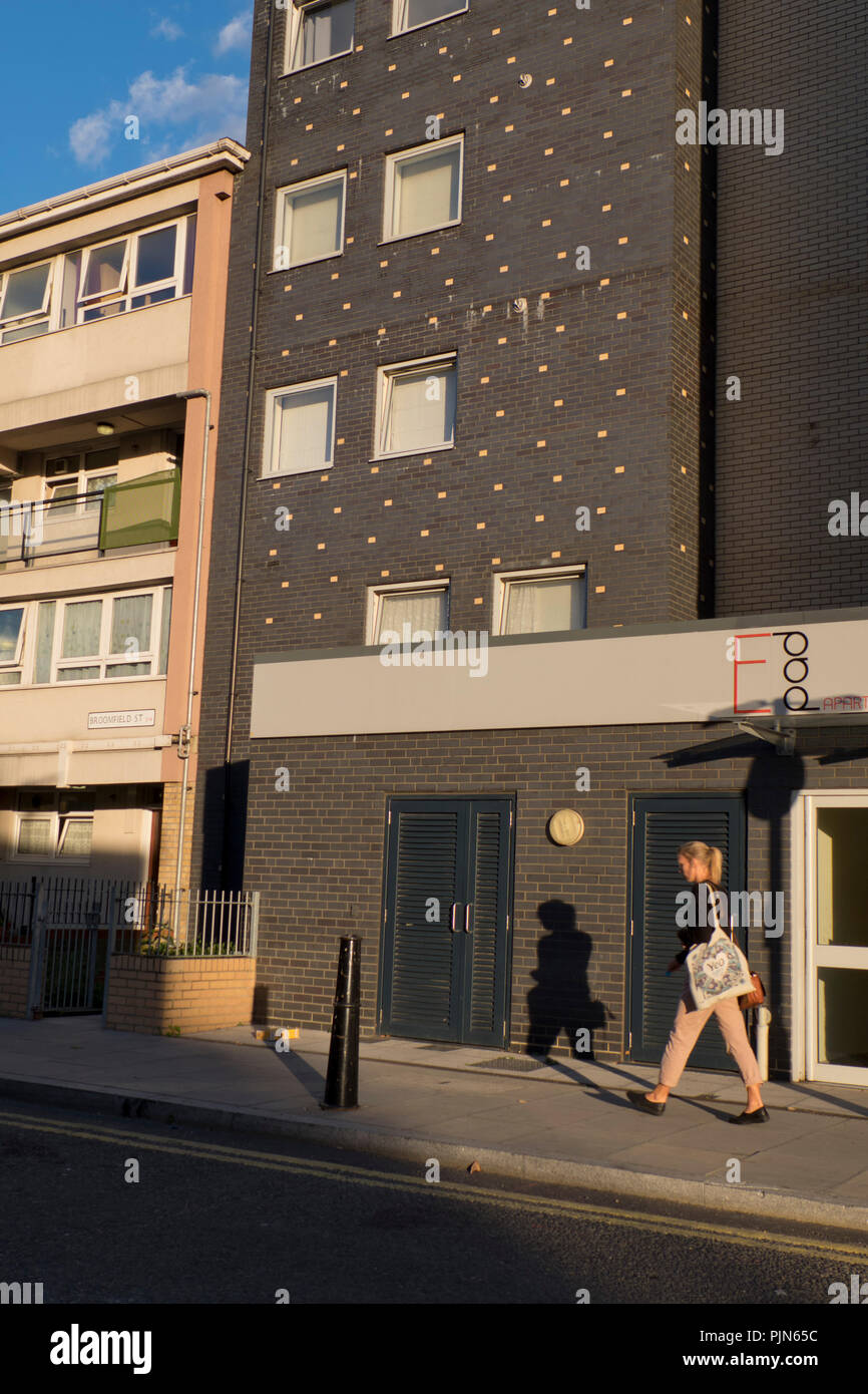 New luxury apartment block next to old social council housing in Poplar ...