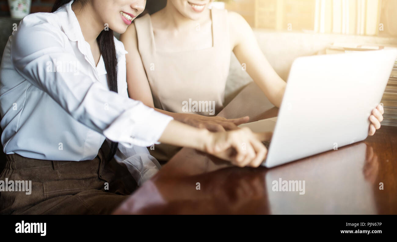 Two young women working and used computer, working concept Stock Photo ...