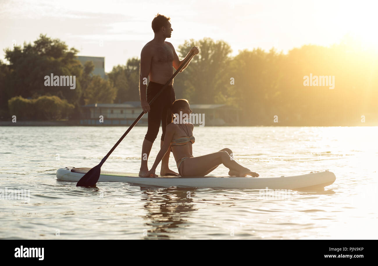 Stand up paddle surfing and stand up paddle boarding sup hi-res stock ...